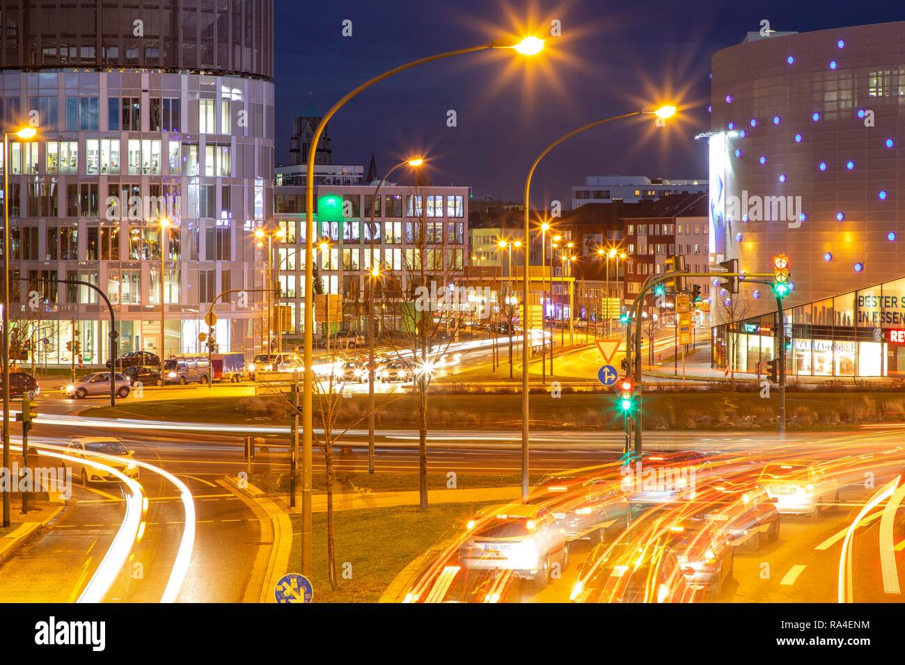Evening city centre traffic in Essen, large intersection, roundabout ...