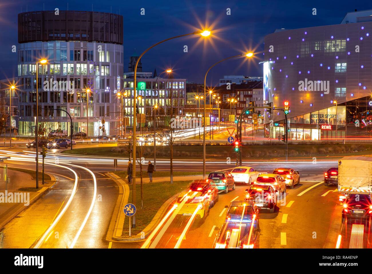 Evening city traffic in Essen, Germany, large intersection, roundabout ...