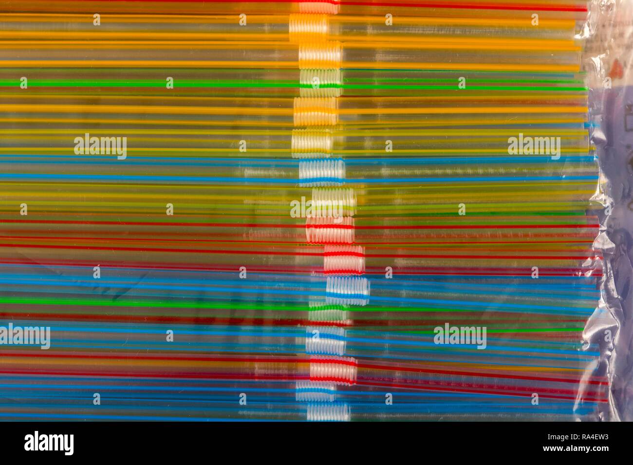 Plastic drinking straws, plastic waste, different colours and sizes ...