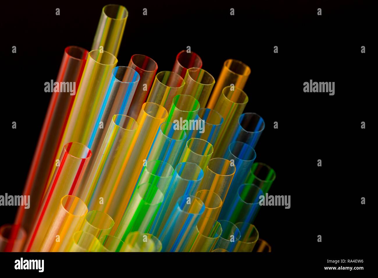 Plastic drinking straws, plastic waste, different colours and sizes ...