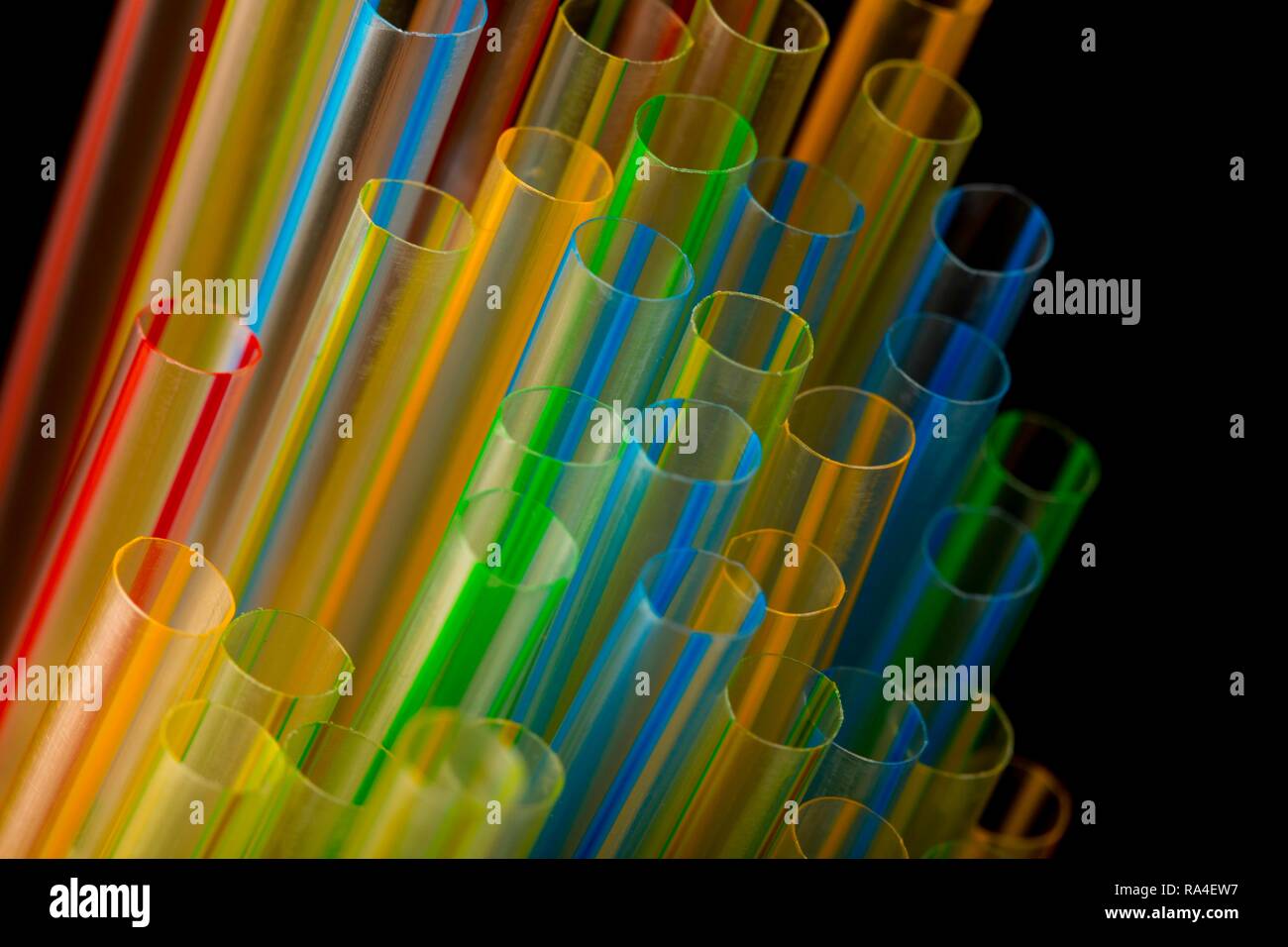 Plastic drinking straws, plastic waste, different colours and sizes ...