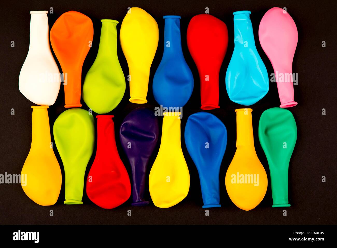 Coloured balloons, after use plastic garbage Stock Photo - Alamy