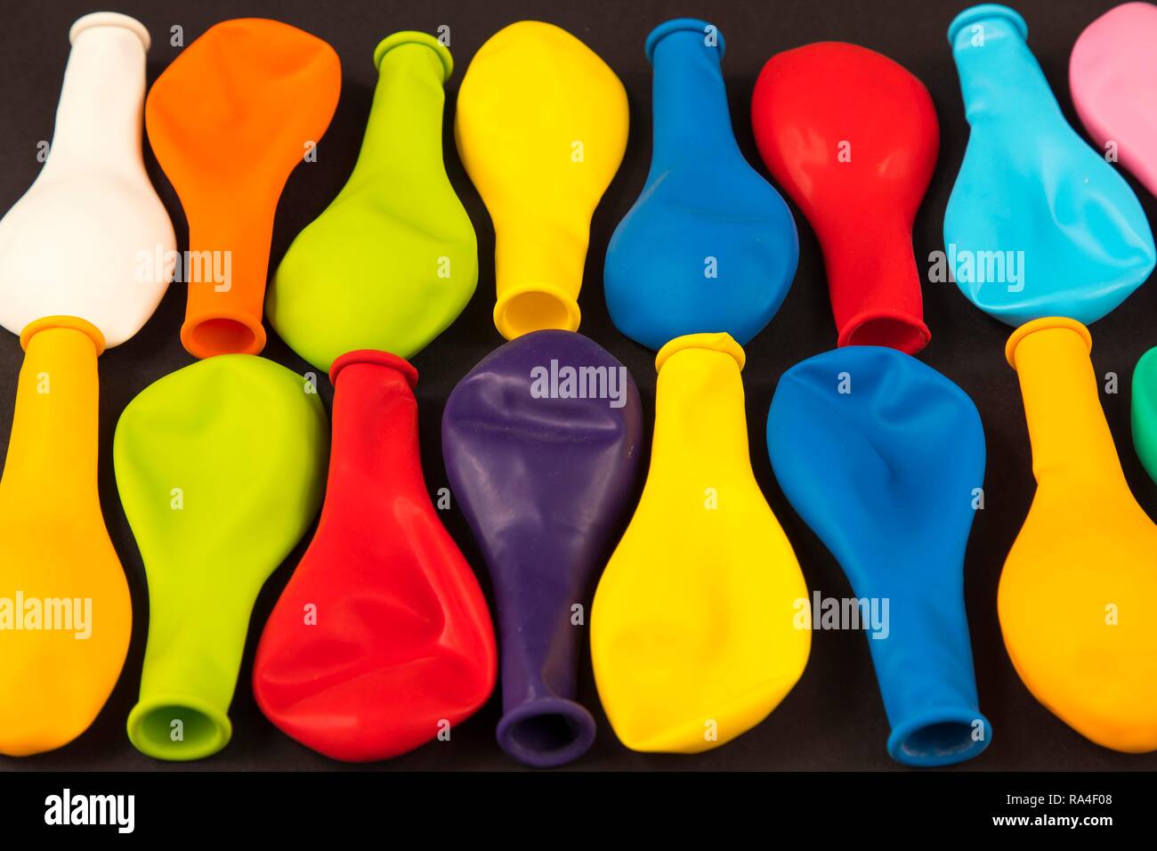 Coloured balloons, after use plastic garbage Stock Photo - Alamy