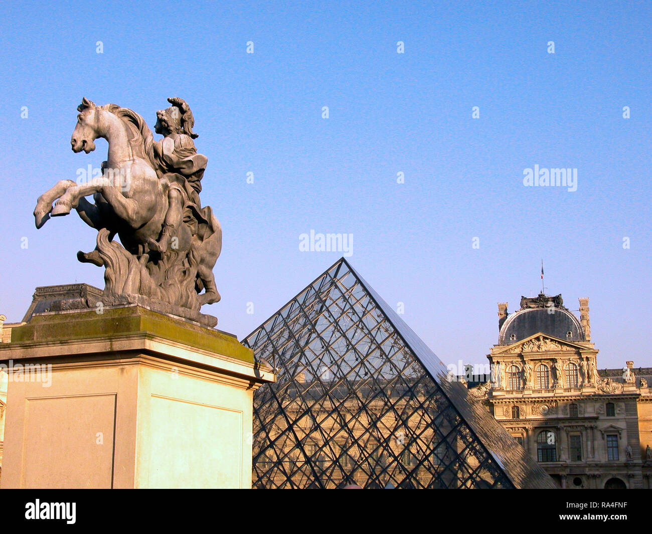 Pyramid and equestrian statue of Louis XIV in the Cour Napoléon ...