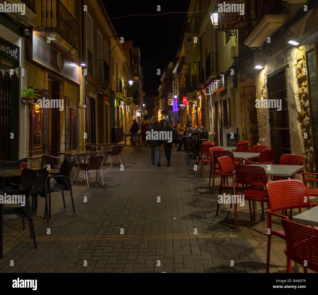 NIGHT PHOTO OF A STREET BAR AREA WITH MANY PEOPLE Stock Photo - Alamy