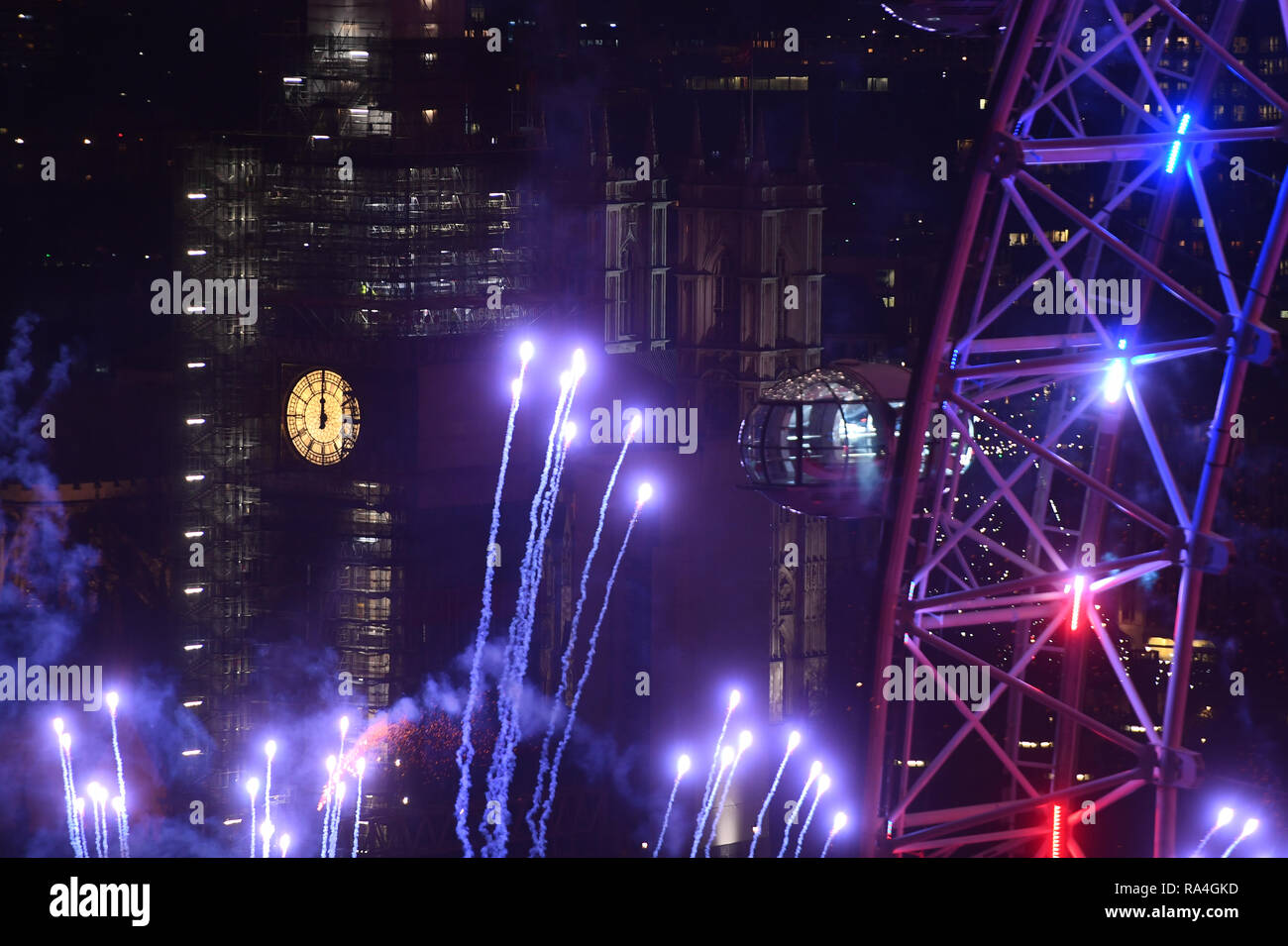 Fireworks light up the sky over the London Eye in central London during ...