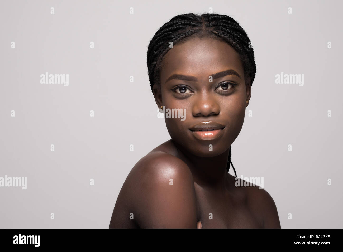 Healthy skin african woman beautiful face close up over gray background ...