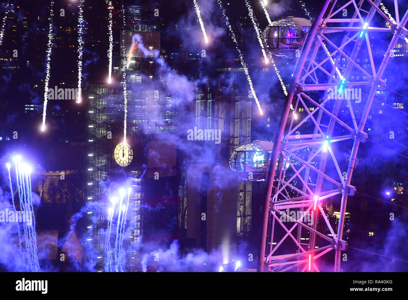 Fireworks light up the sky over the London Eye in central London during ...