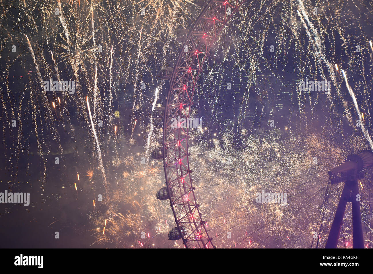 Fireworks light up the sky over the London Eye in central London during ...