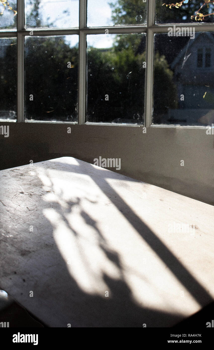 Shadow table window Stock Photo - Alamy