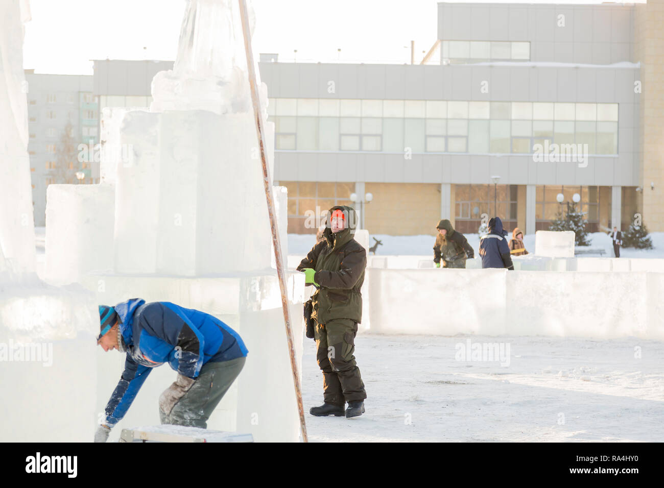 Workers at the construction site of the ice town for a conversation ...