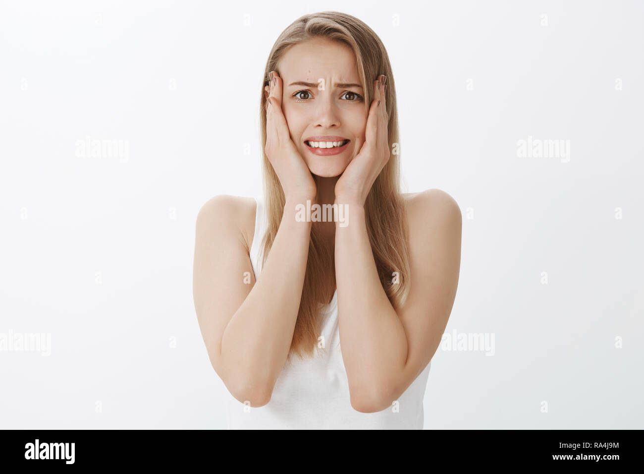 Young woman hands grabbing hair hi-res stock photography and images - Alamy