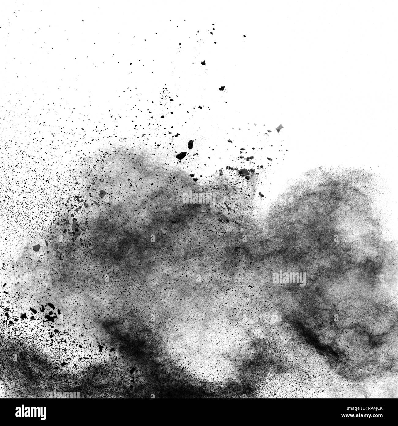 Black powder explosion against white background.The particles of ...