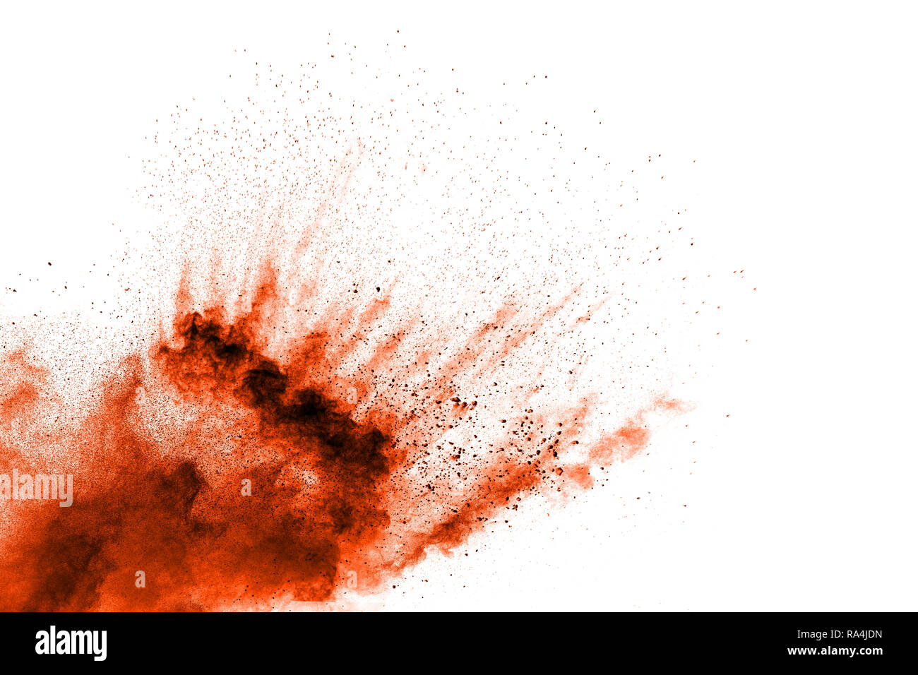 Orange color powder explosion on white background Stock Photo - Alamy