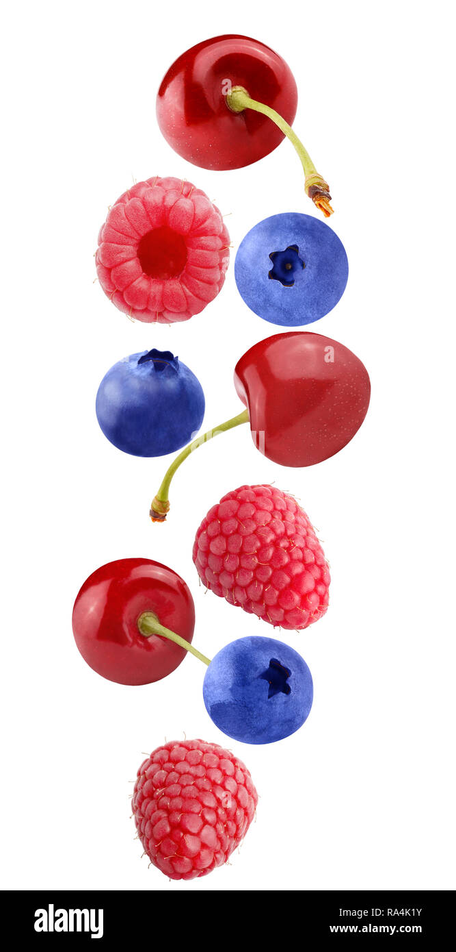 Isolated falling fruits. Flying cherry, raspberry and blueberry ...