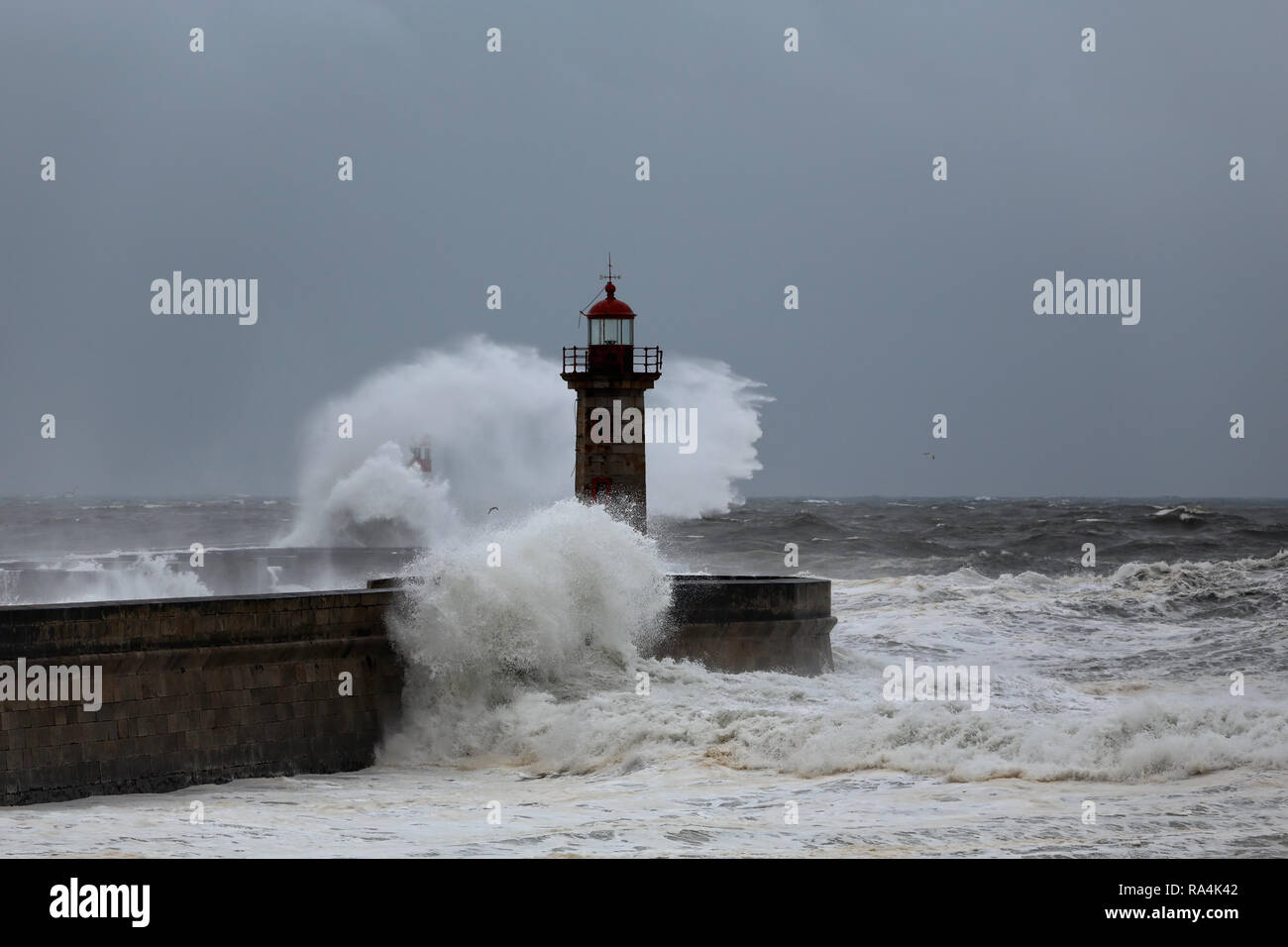 Stormy big wave over south piers and lighthouses of river Douro harbor ...