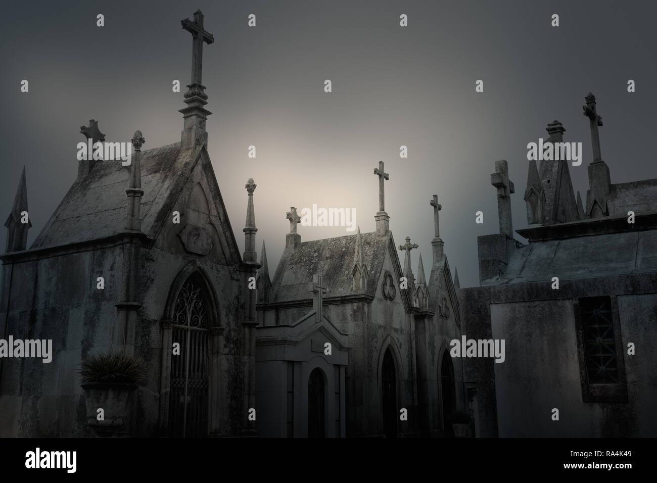 Old dramatic cemetery in an overcast evening Stock Photo - Alamy