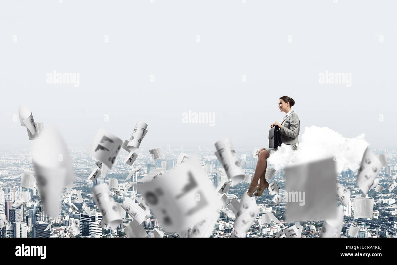Woman float above city on cloud and papers flying around Stock Photo ...