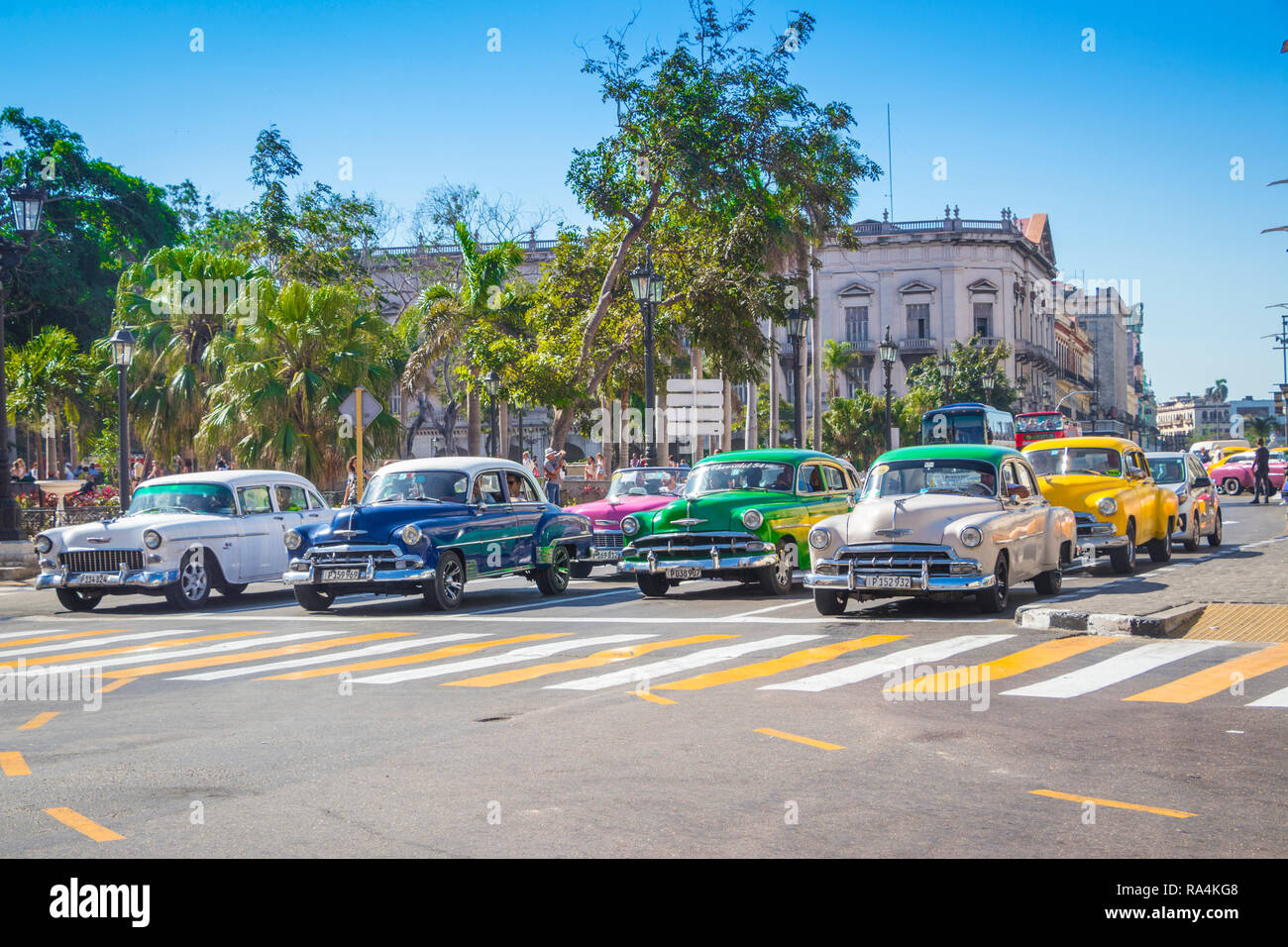 classic old American cars driving down a havana street in Cuba Stock ...