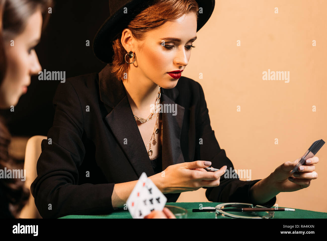 Two girls playing cards hi-res stock photography and images - Alamy