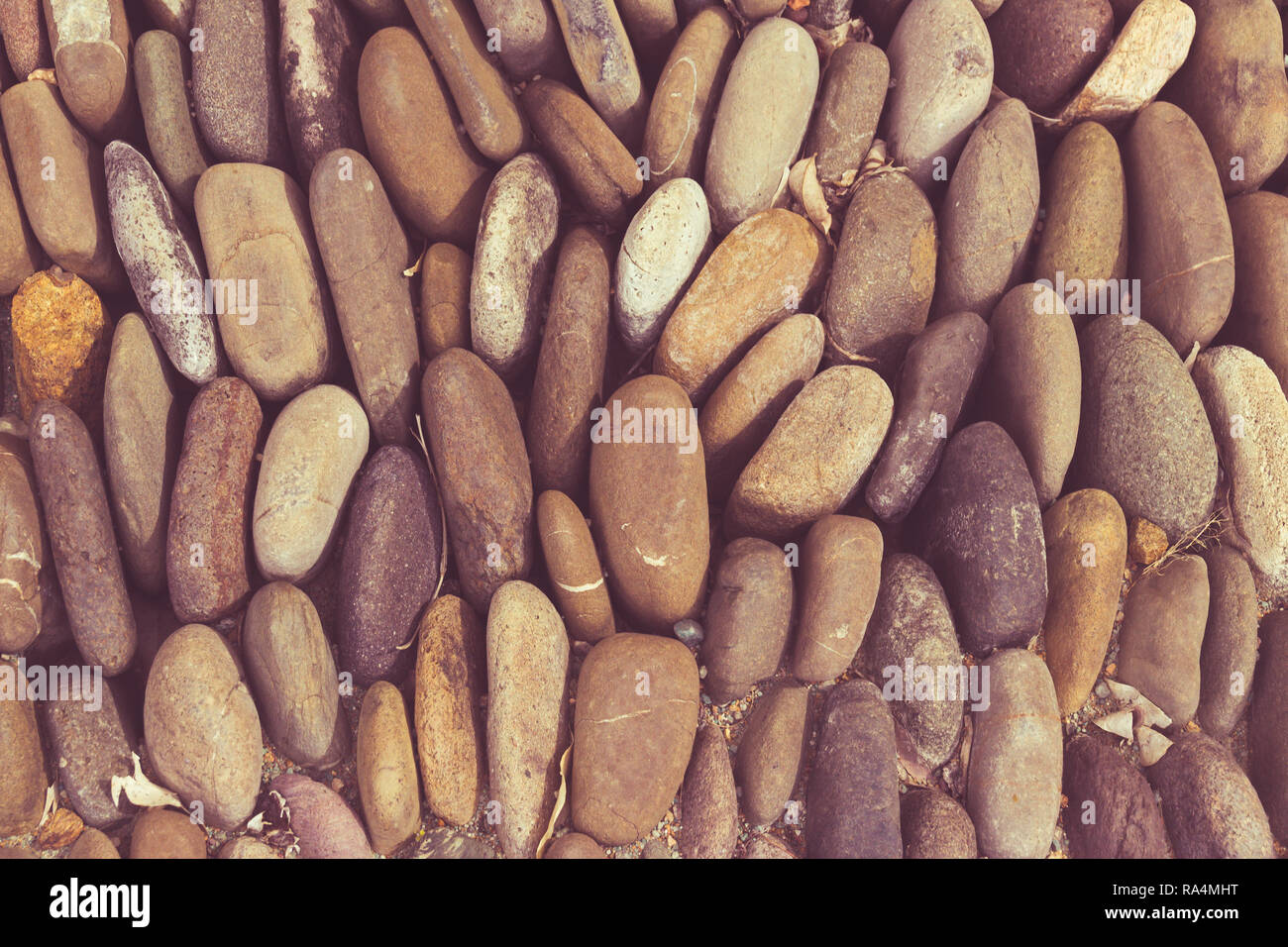 Photograph of a rounded river rocks background Stock Photo - Alamy