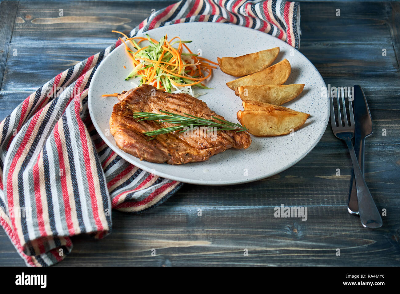 grilled beef steak with vegetables on plate Stock Photo - Alamy