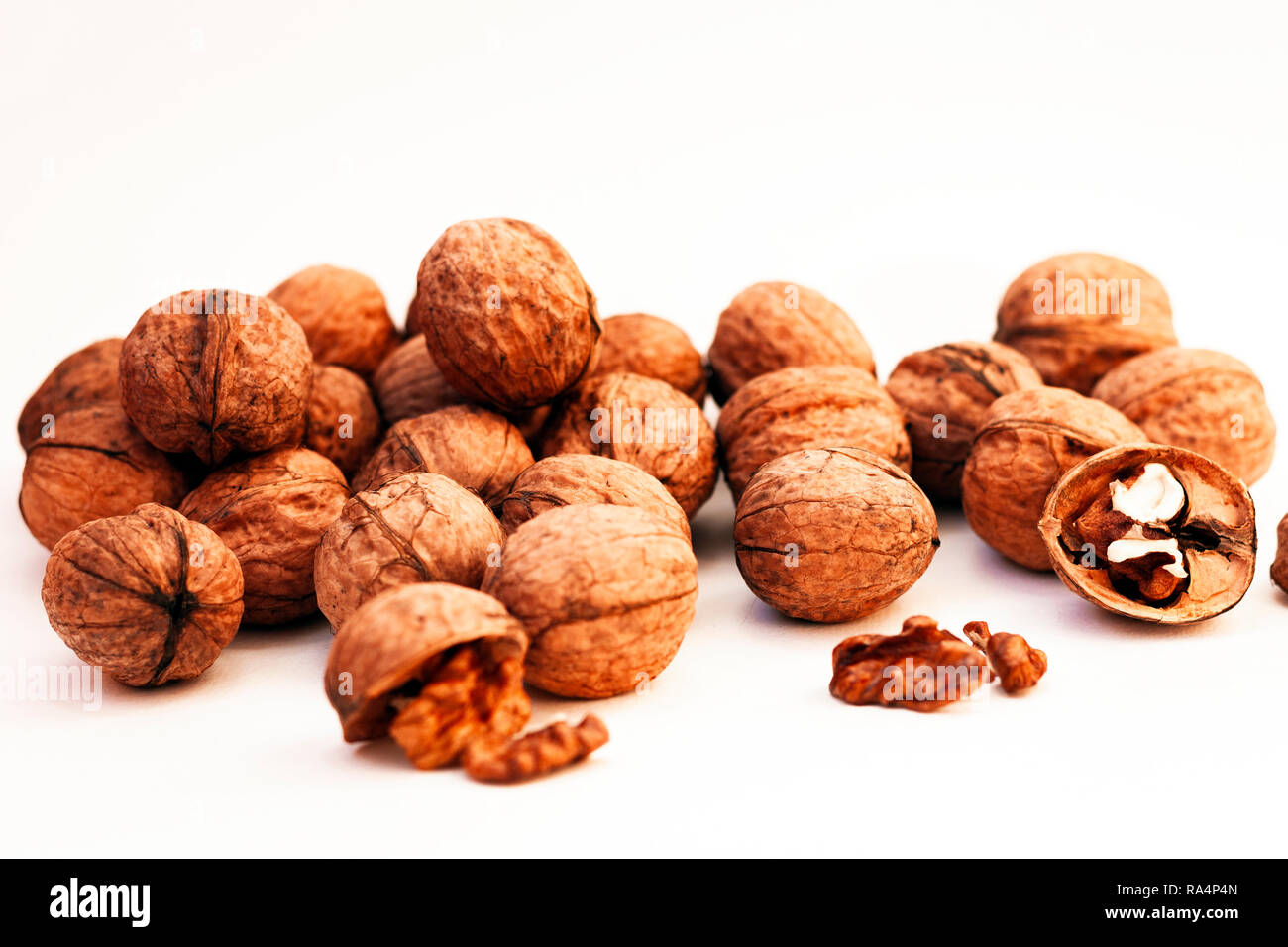 Whole walnuts kernels on white background Stock Photo - Alamy