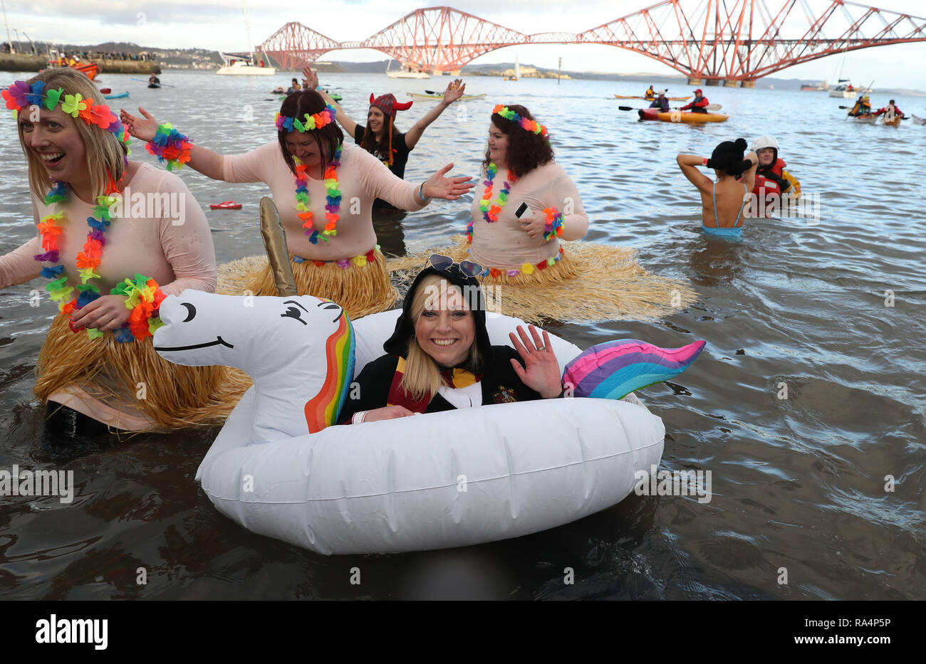 People take part in the annual Loony Dook swim in Firth of Forth ...