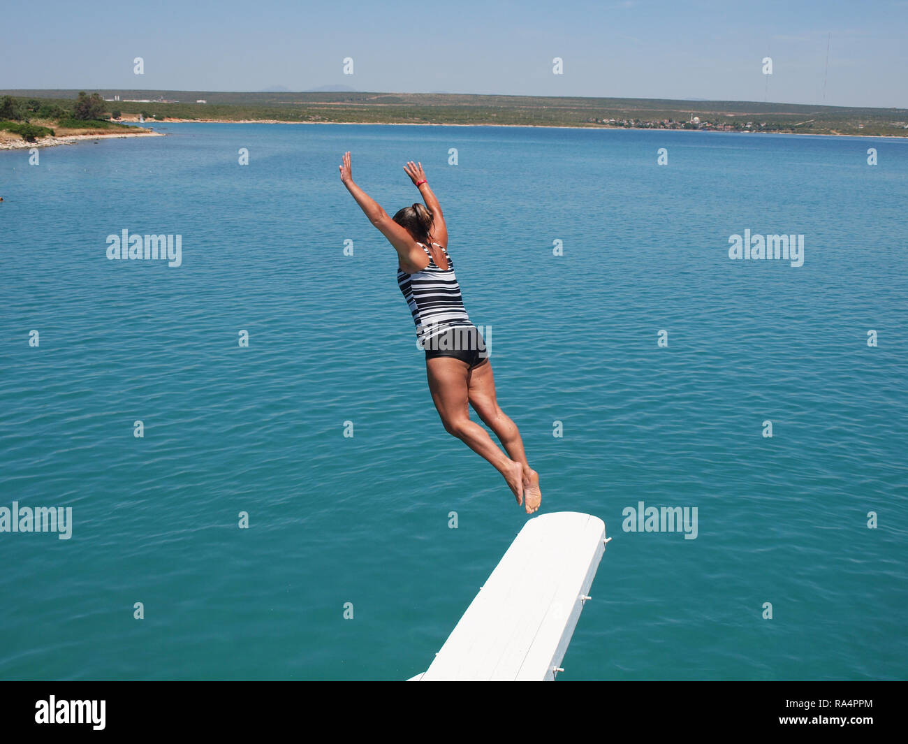 Woman Jumping Off Boat Water High Resolution Stock Photography and ...