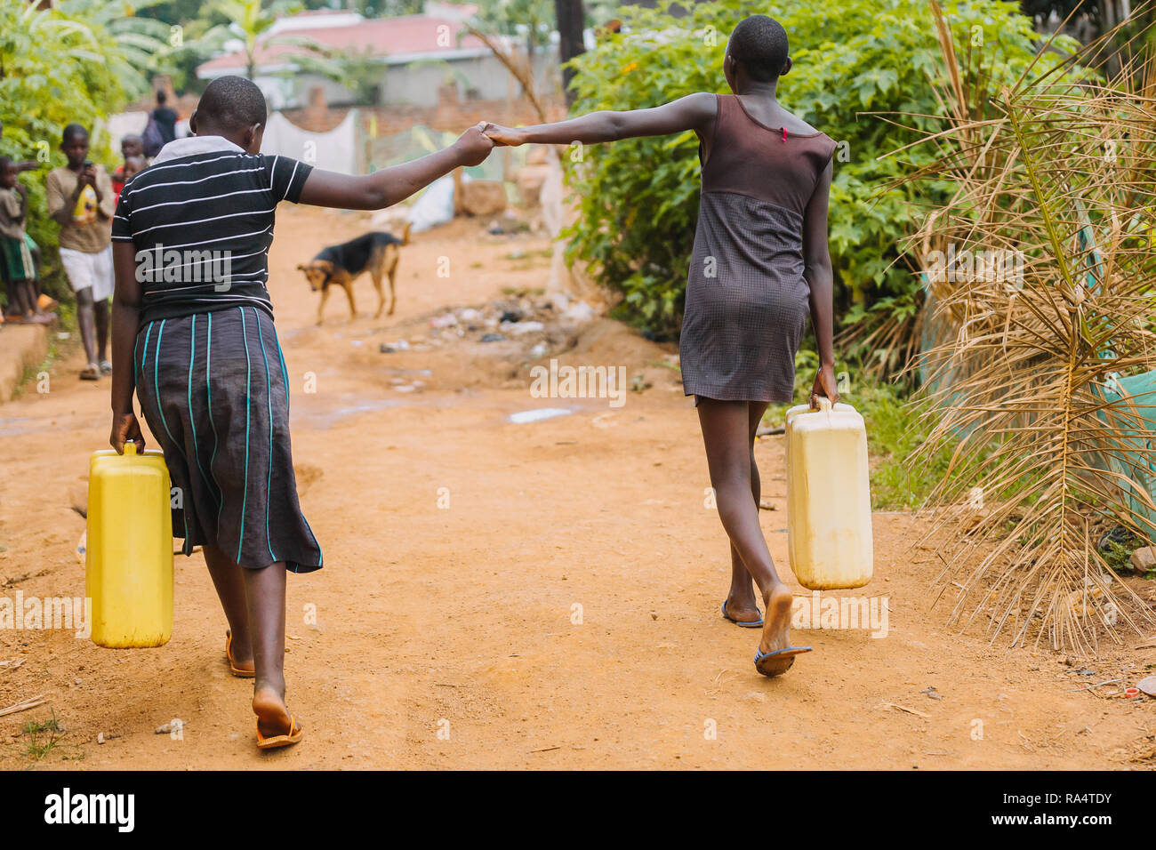Child carrying water in Uganda, Africa Stock Photo - Alamy