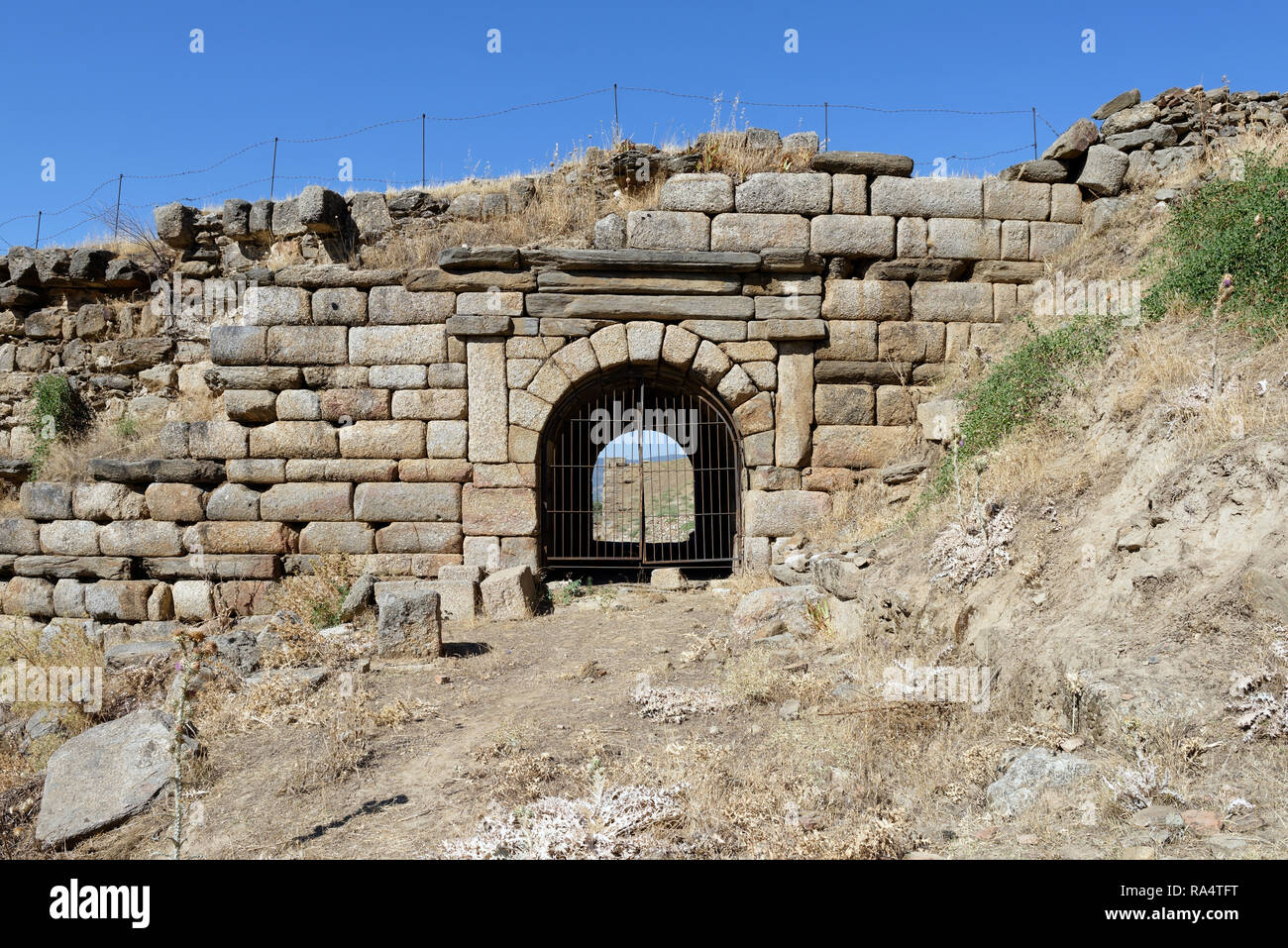 Bossed ashlar retaining wall with spectators arched entrance of the ...