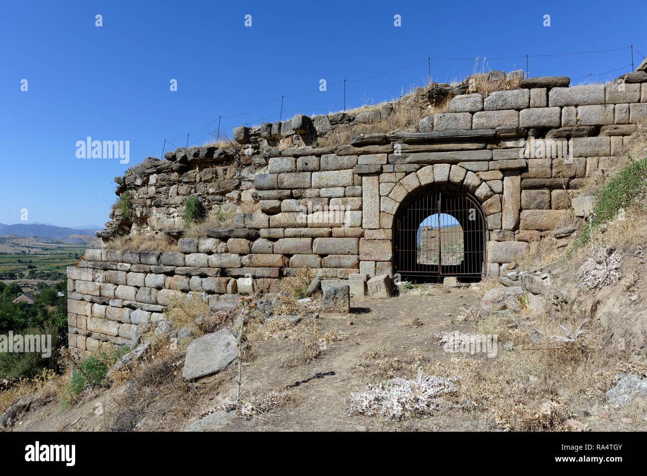 Bossed ashlar retaining wall with spectators arched entrance of the ...