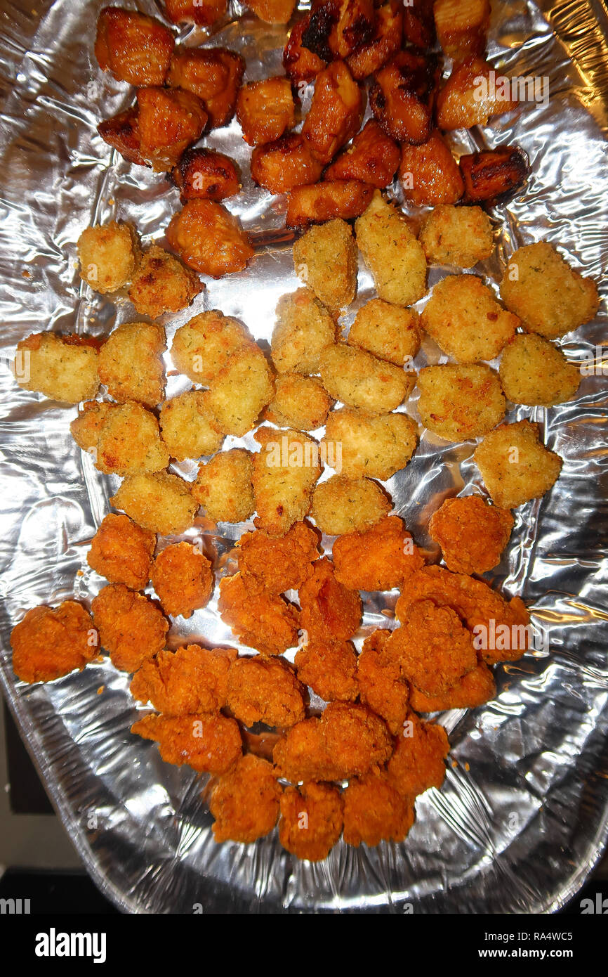 Tinfoil tray full of party food Stock Photo - Alamy