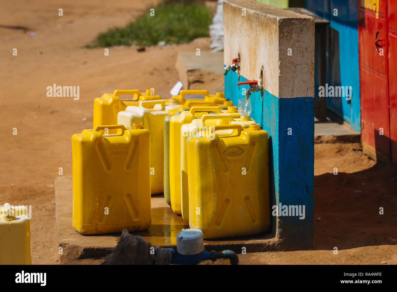 Children carrying water cans in Uganda, Africa Stock Photo - Alamy