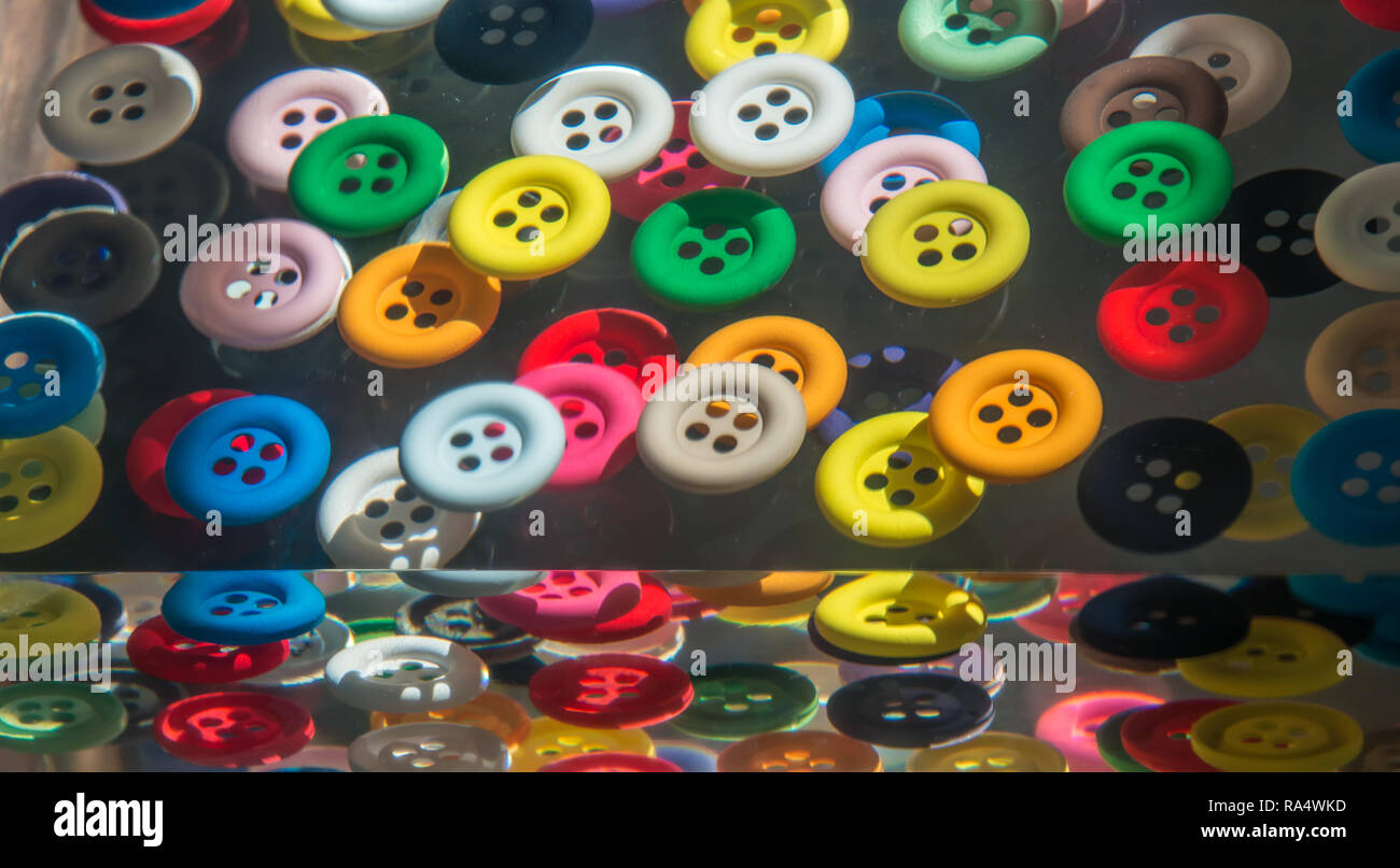color buttons in resin reflecting Stock Photo - Alamy