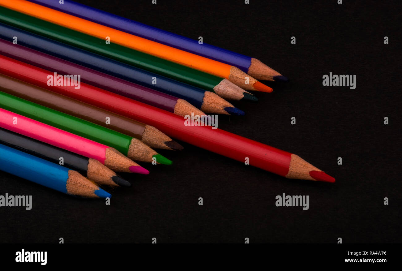 Color Pencils On Black Background Stock Photo - Alamy