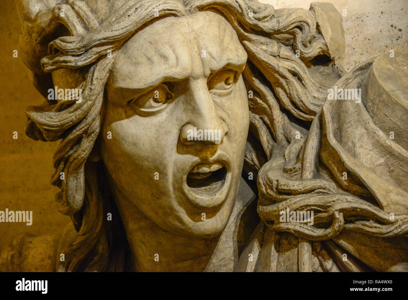 angry screaming man statue in Paris Stock Photo - Alamy