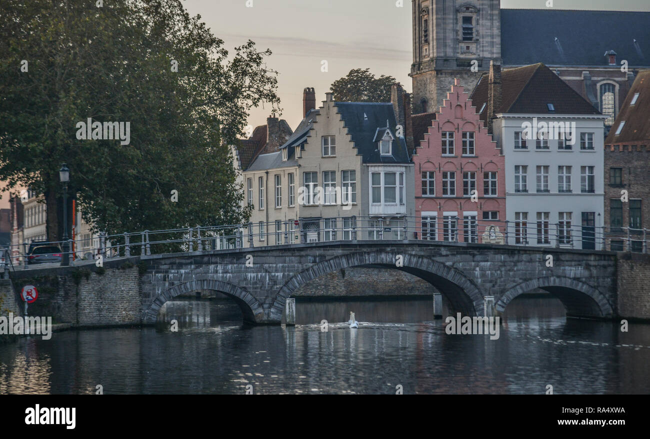 Old buildings with canal in Bruges, Belgium. Bruges is one of the most ...