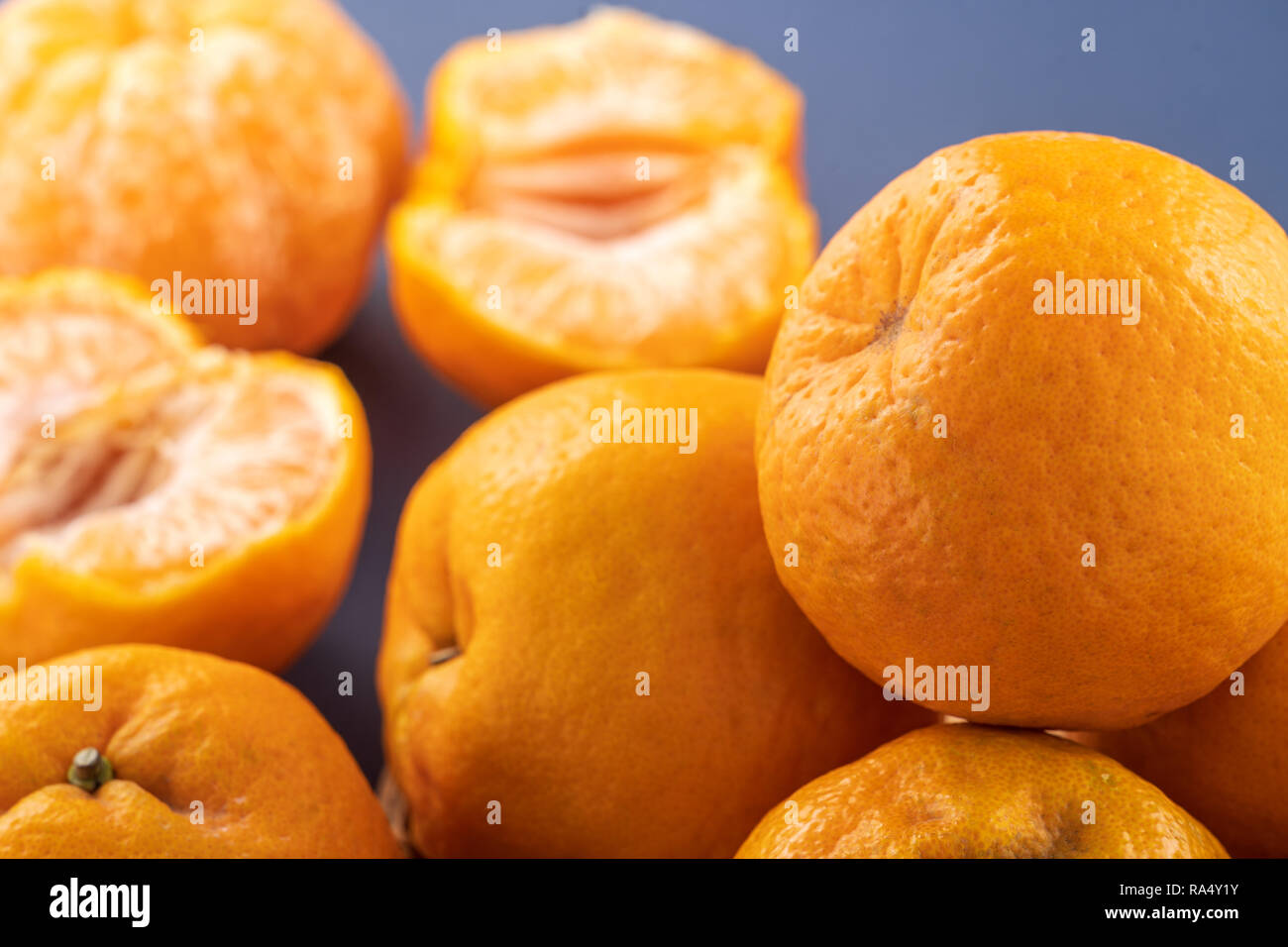 Beautiful and delicous tangerine isolated on airy blue background with ...