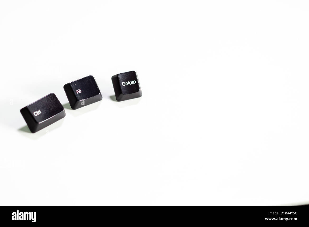 Loose Ctrl Alt Delete computer keys on white background Stock Photo - Alamy