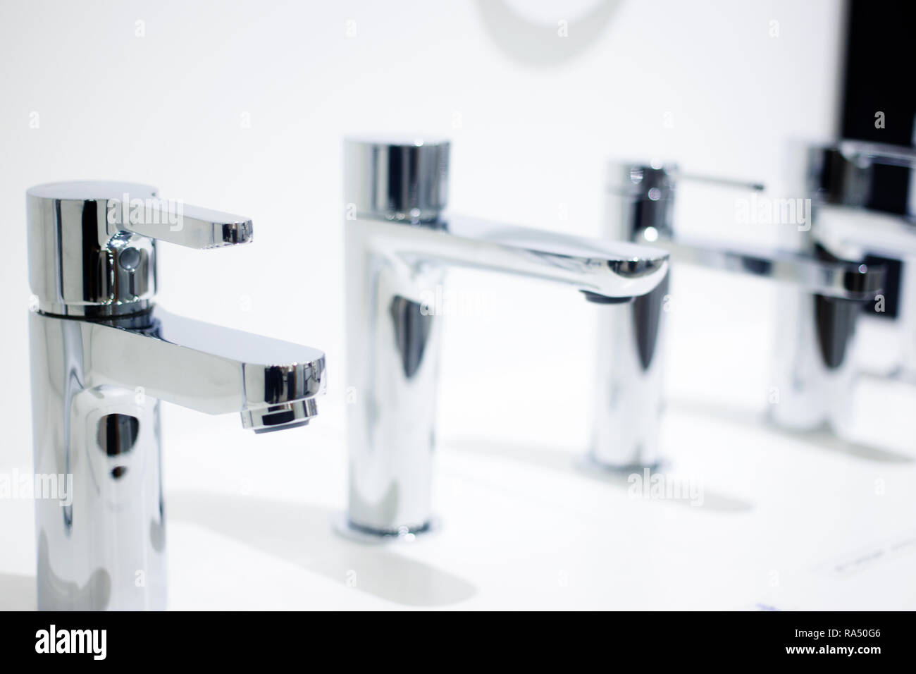 Bathroom showroom display of new sink chrome tap design option for home ...