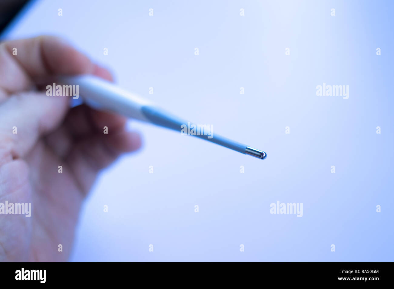 Digital medical thermometer instrument used by doctor or nurse to ...