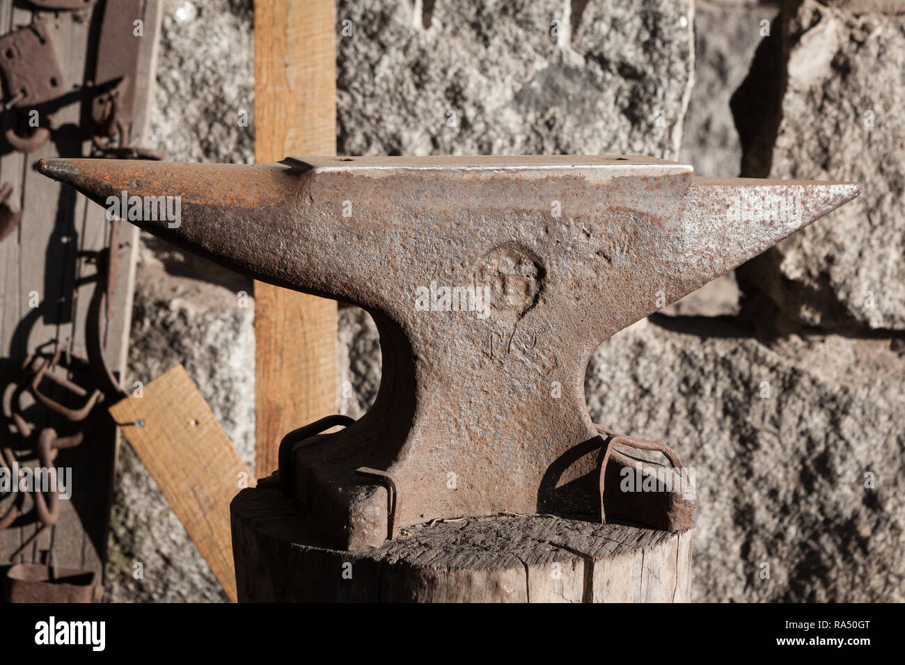 Old rusty iron anvil Stock Photo - Alamy