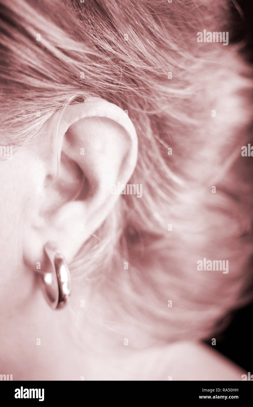Deaf lady with modern technology digital hearing aid in her ear Stock ...