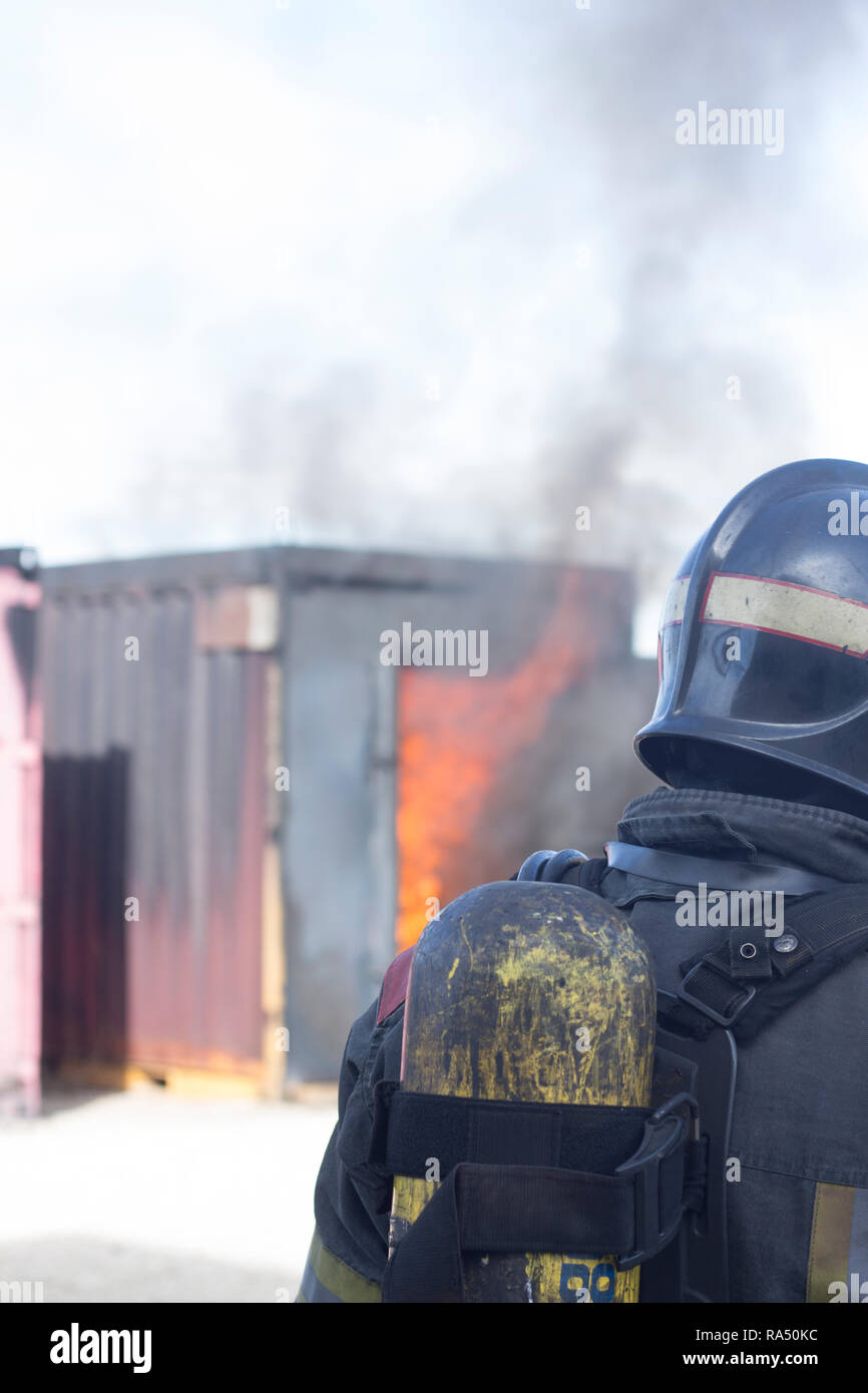 Firefighter putting out fire training station extinguisher backdraft ...