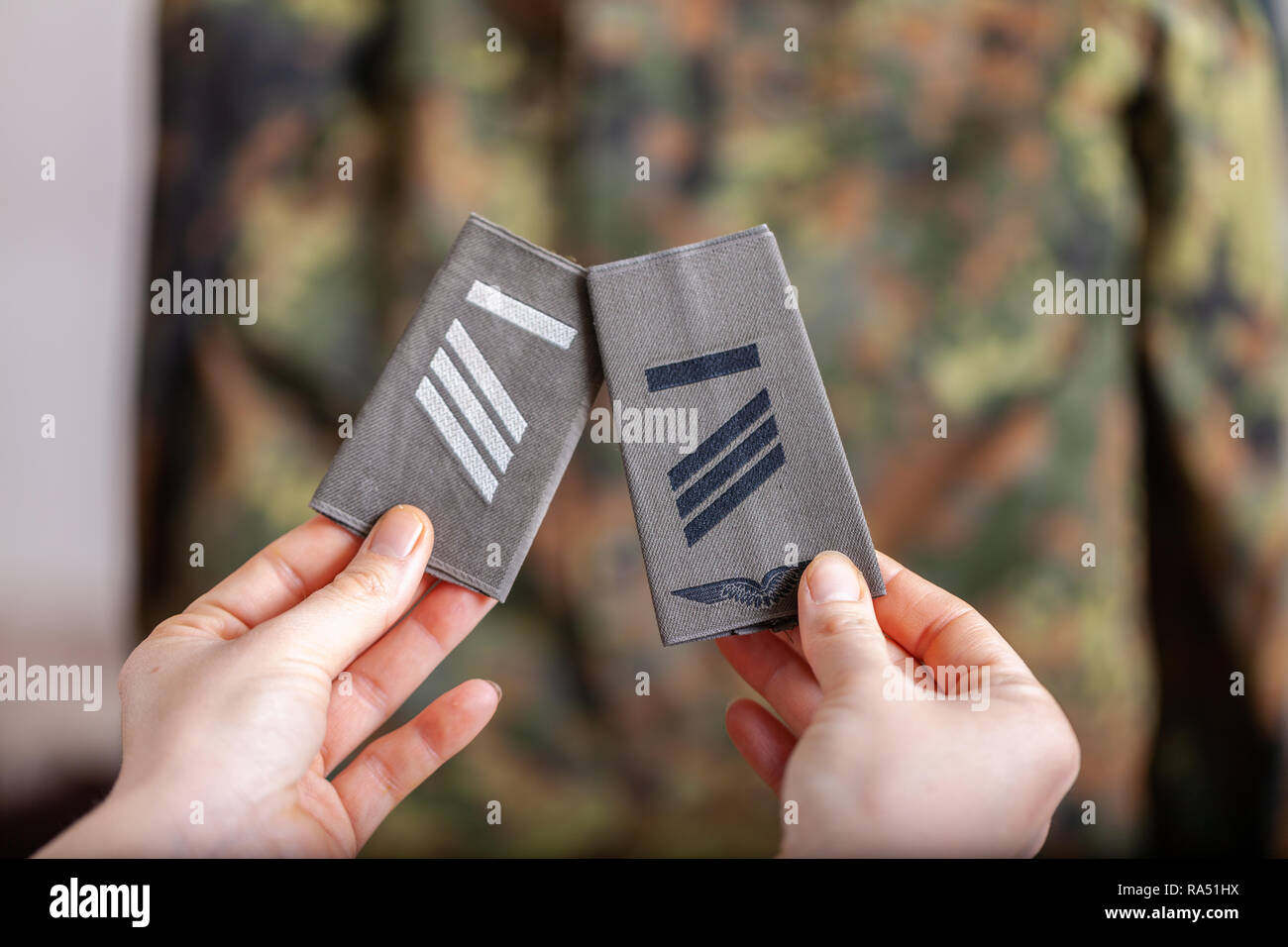 german shoulder ranks on a camouflage background Stock Photo - Alamy