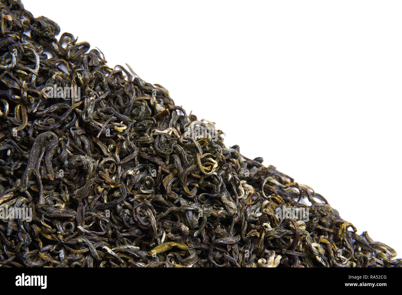 A pile of dry green tea. Isolated on white background Stock Photo - Alamy