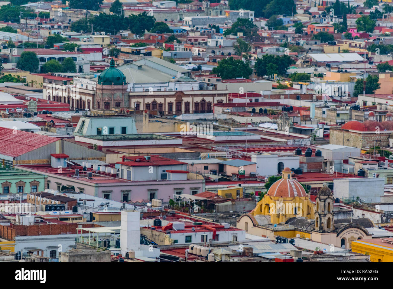 Partial view of Oaxaca city center, from above, with many colorful ...