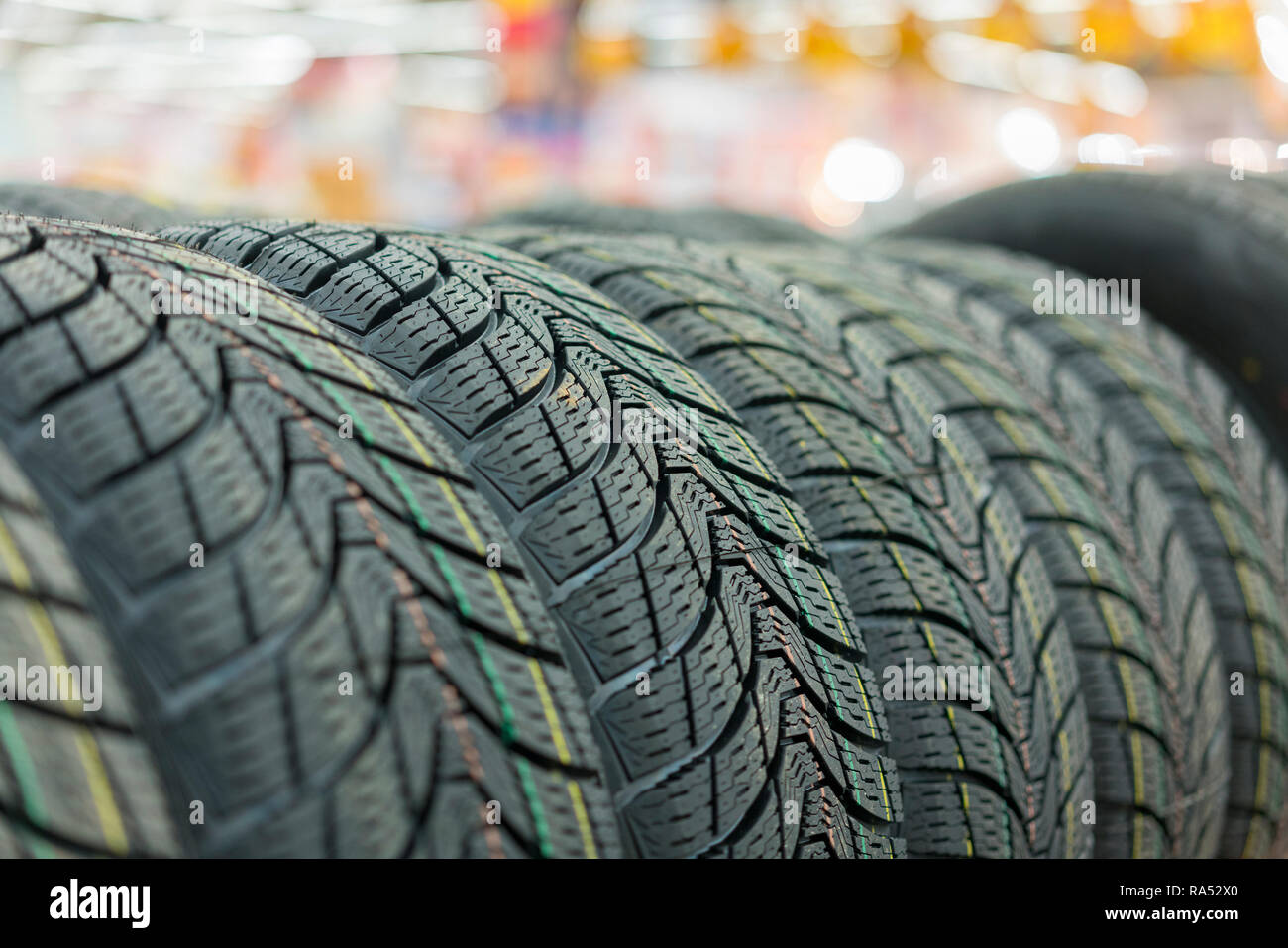 new tires for sale at booth in store Stock Photo - Alamy