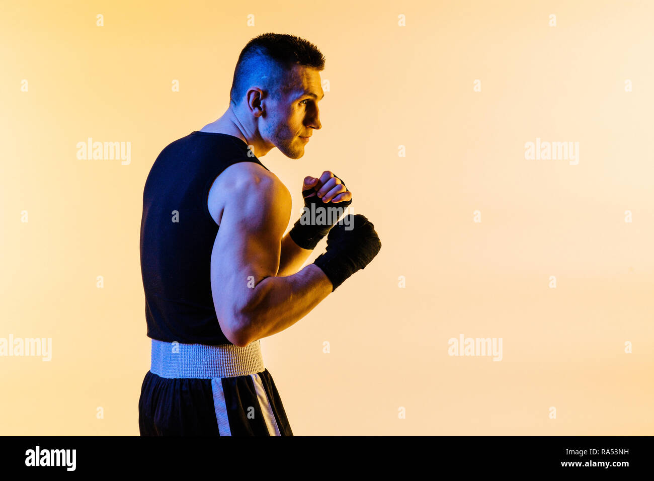 studio portrait of a fighter in defense position Stock Photo - Alamy
